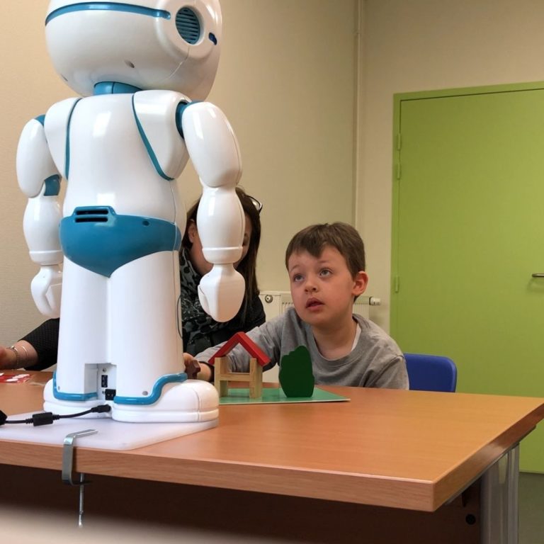 Robot helping children with autism to focus by behaving simple and ...