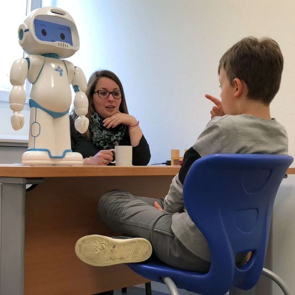 Robot helping children with autism to focus by behaving simple and ...