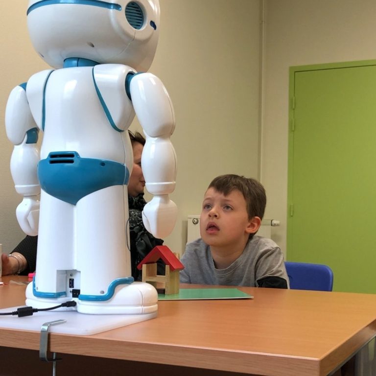 Robot helping children with autism to focus by behaving simple and ...